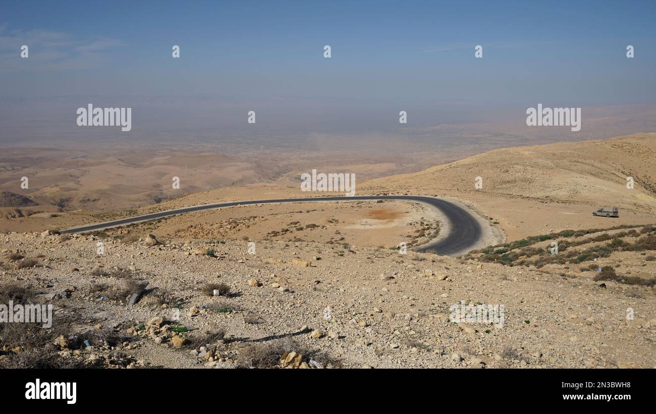 Road to deep alley with Dead sea on border between Jordan and Israel ...