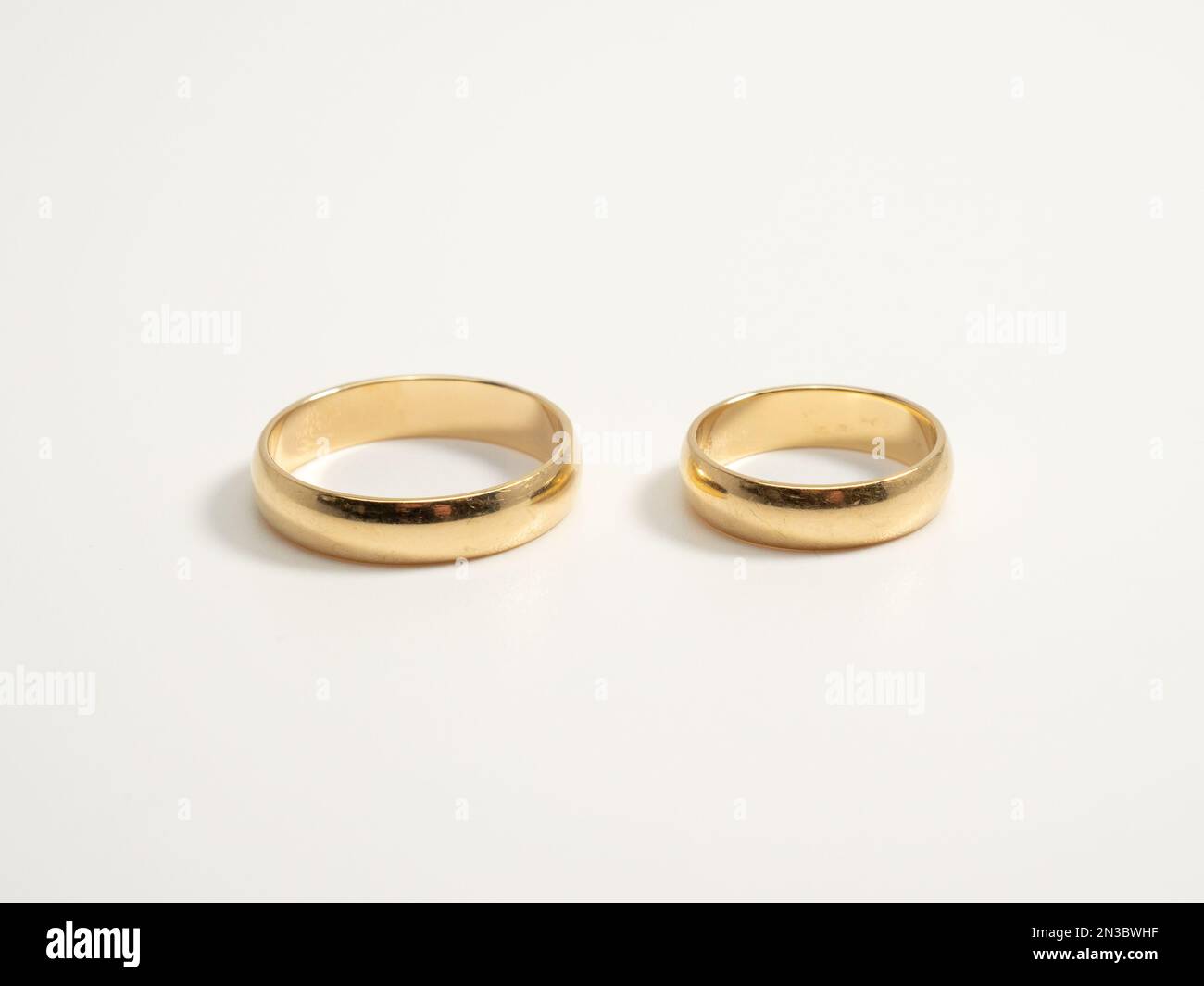 Wedding rings on a light background. Gold rings. Close-up Stock Photo ...