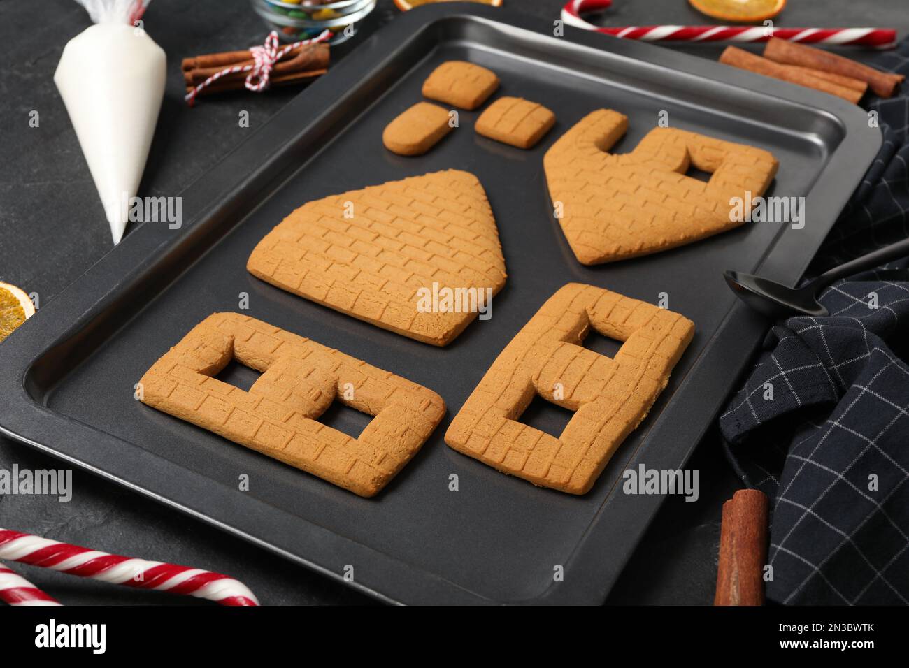 Parts of gingerbread house on black table, closeup Stock Photo - Alamy