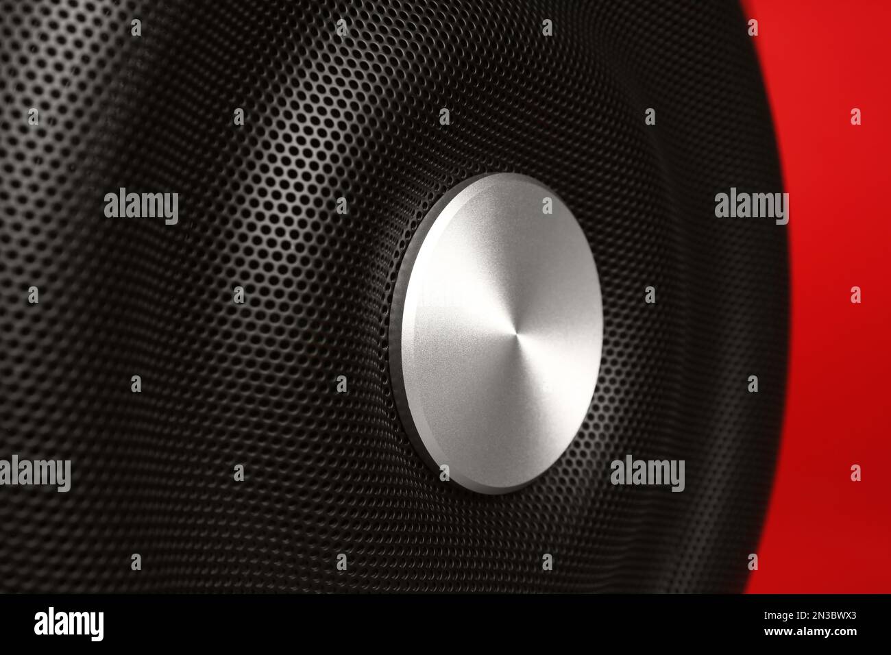 Modern subwoofer on red background, closeup. Powerful audio speaker ...
