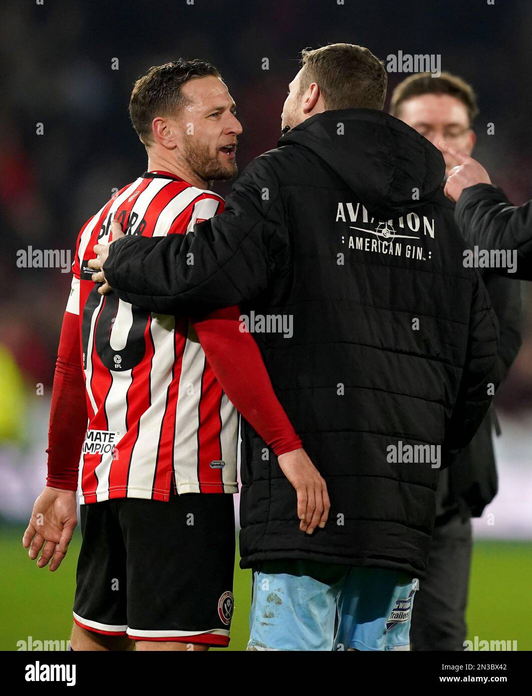 Wrexham manager Phil Parkinson speaks with Sheffield United's Billy ...
