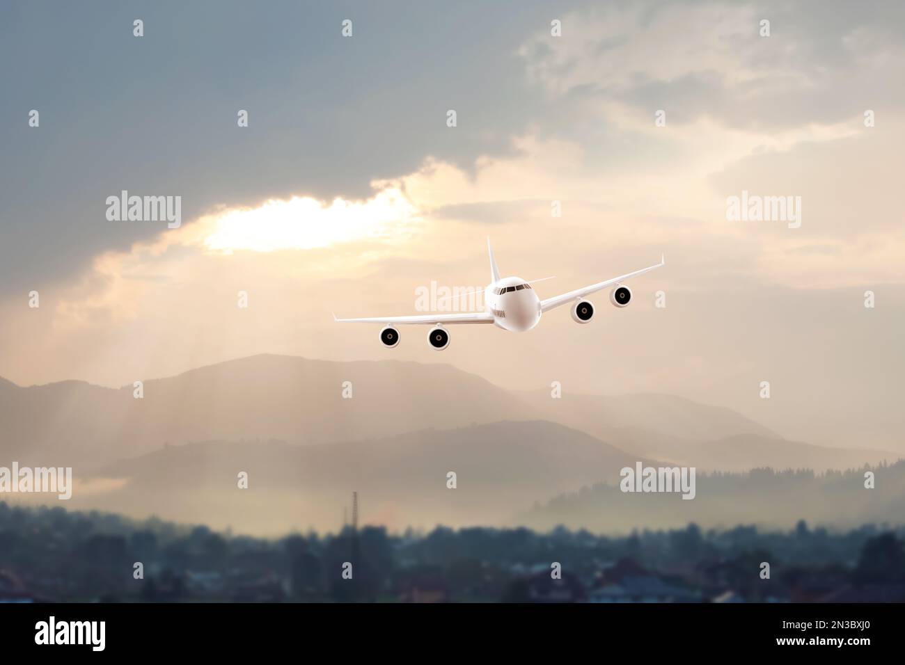 Airplane in sky over hills hi-res stock photography and images - Alamy