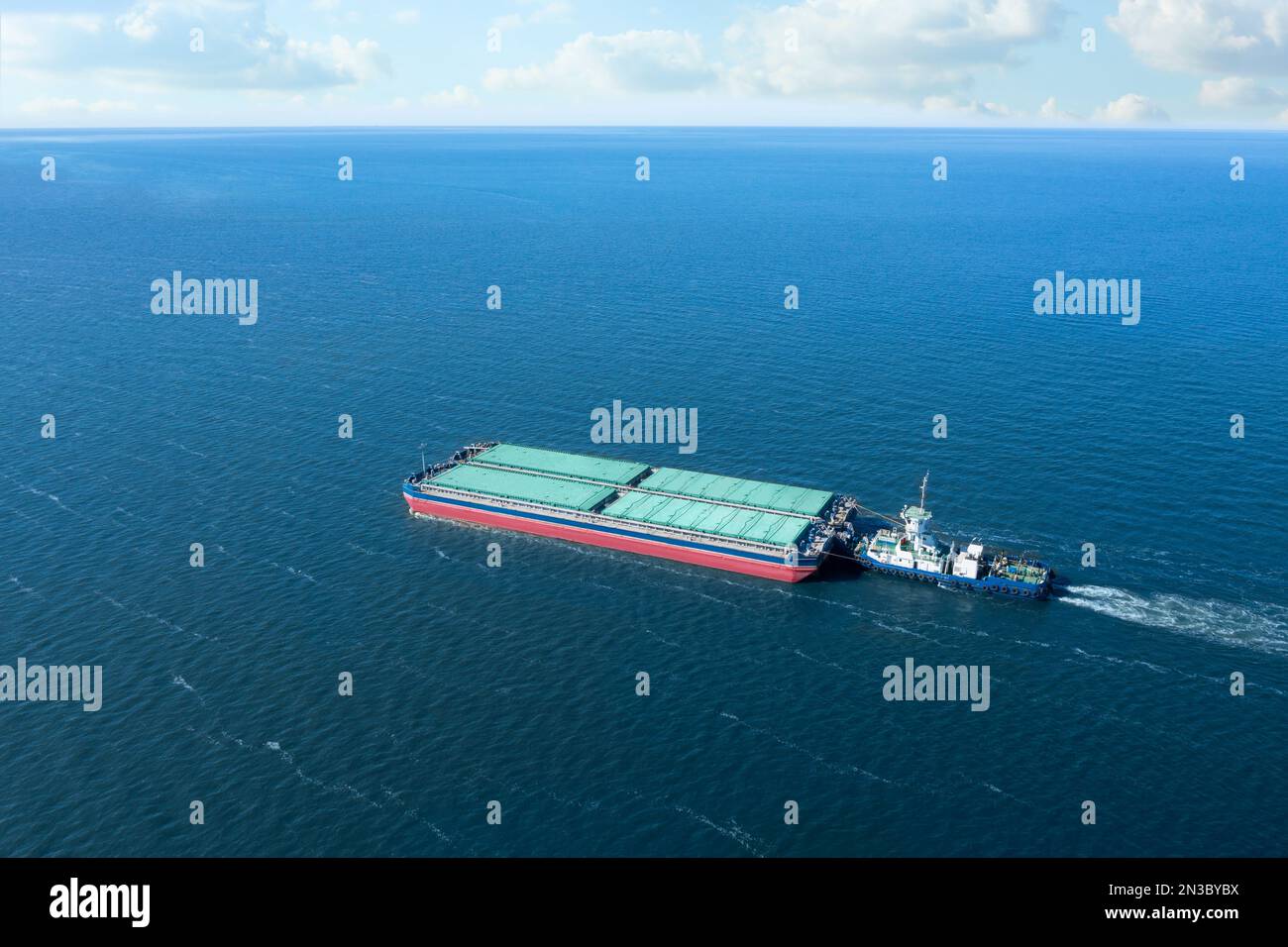 Tugboat pulling barge with cargo by water, aerial view Stock Photo - Alamy