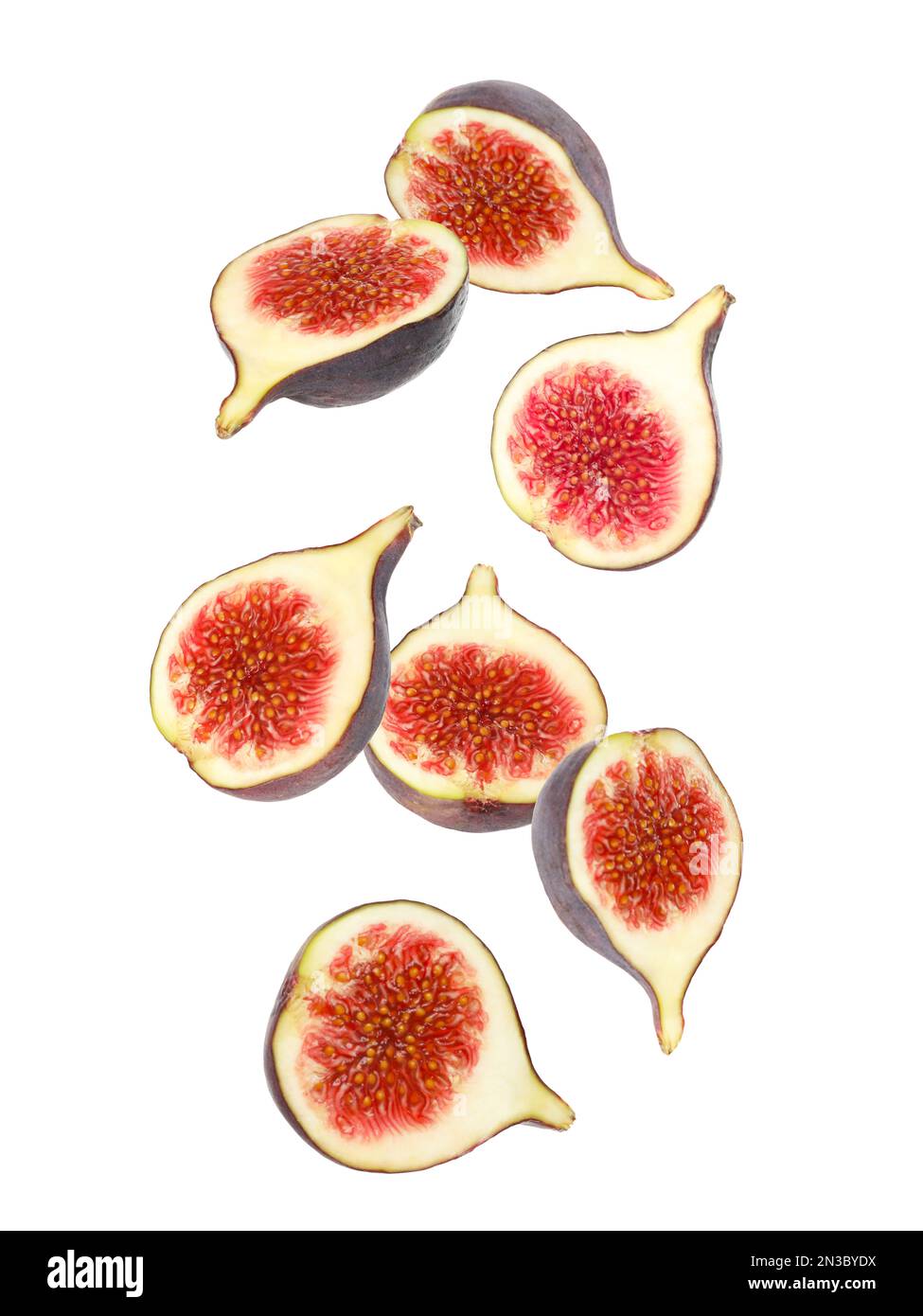 Falling tasty ripe figs on white background Stock Photo - Alamy