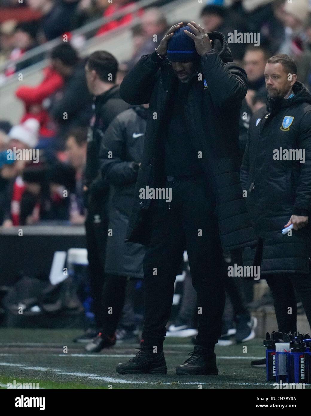 Darren Moore Manager of Sheffield Wednesday holds his head after his ...