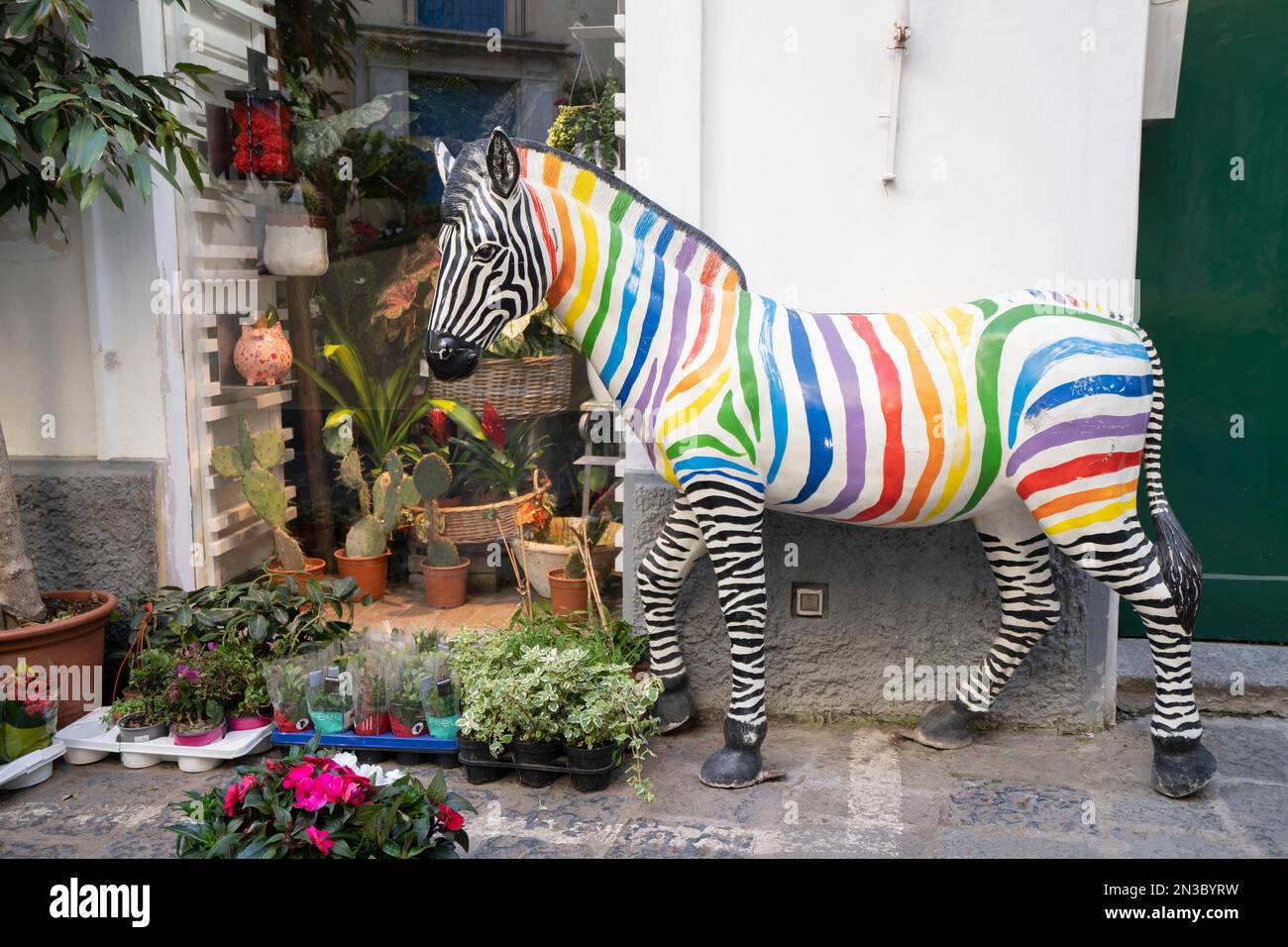 Zebra statue with multi-coloured stripes outside of a restaurant in ...