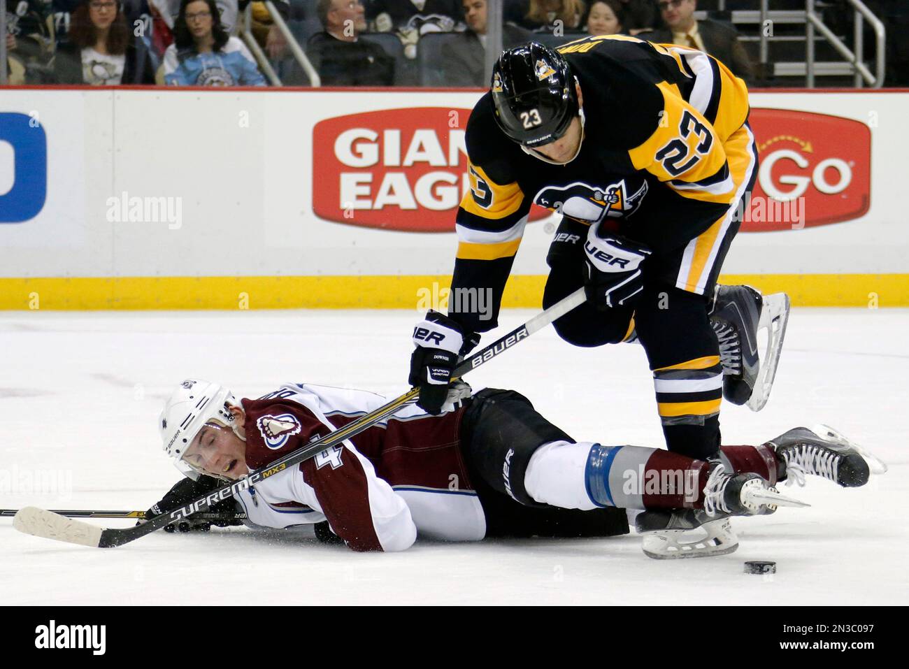 Pittsburgh Penguins' Steve Downie (23) collides with Colorado Avalanche ...