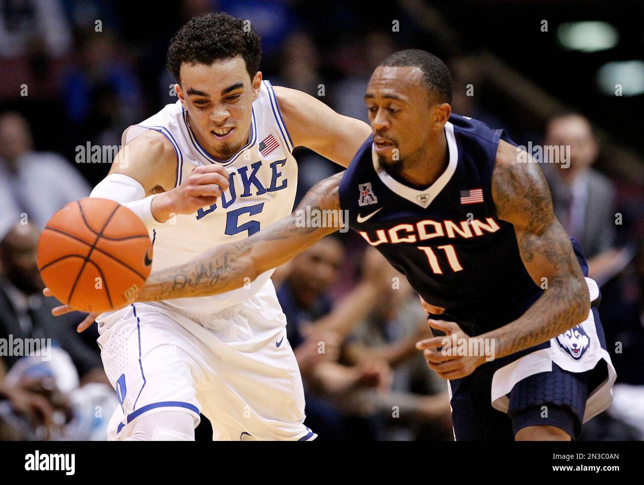 Connecticut guard Ryan Boatright (11) makes a steal against Duke guard ...