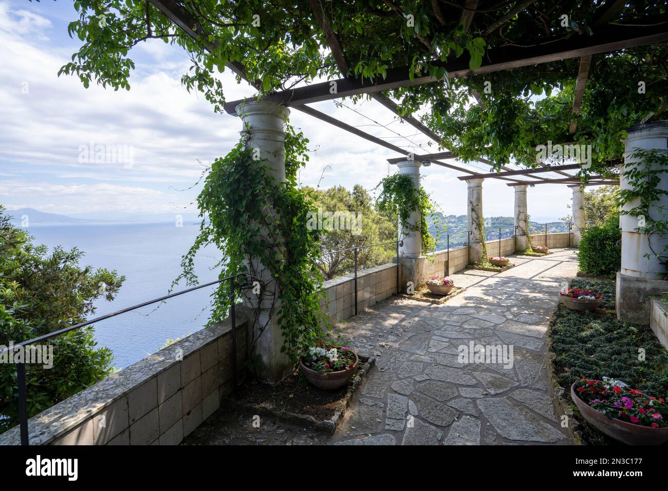 View of the Bay of Naples through the pergola and walkway at Villa San ...