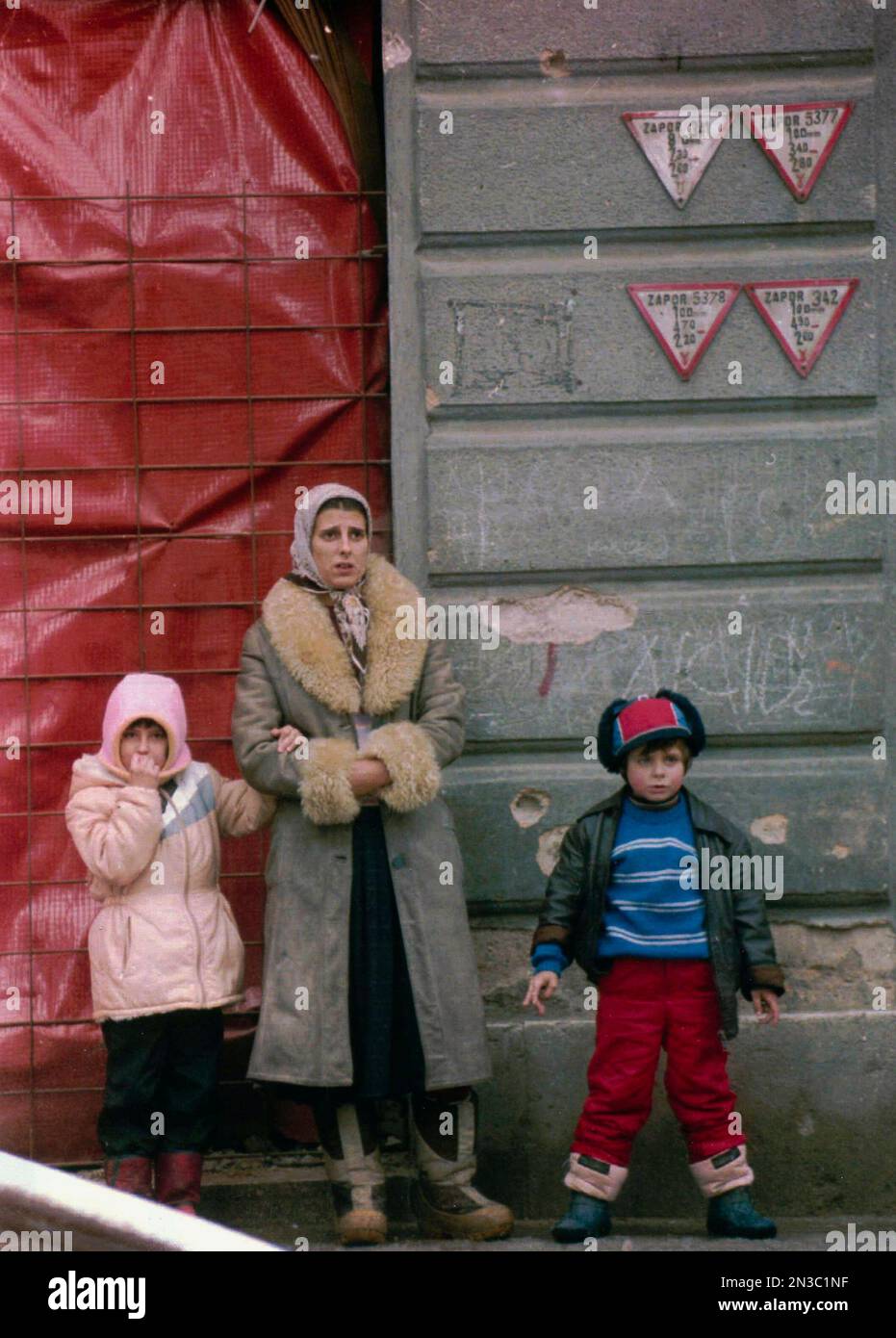 Dzenana Sokolovic, her son, Nermin Divovic, right and daughter (name unknown) stand outside of a ...