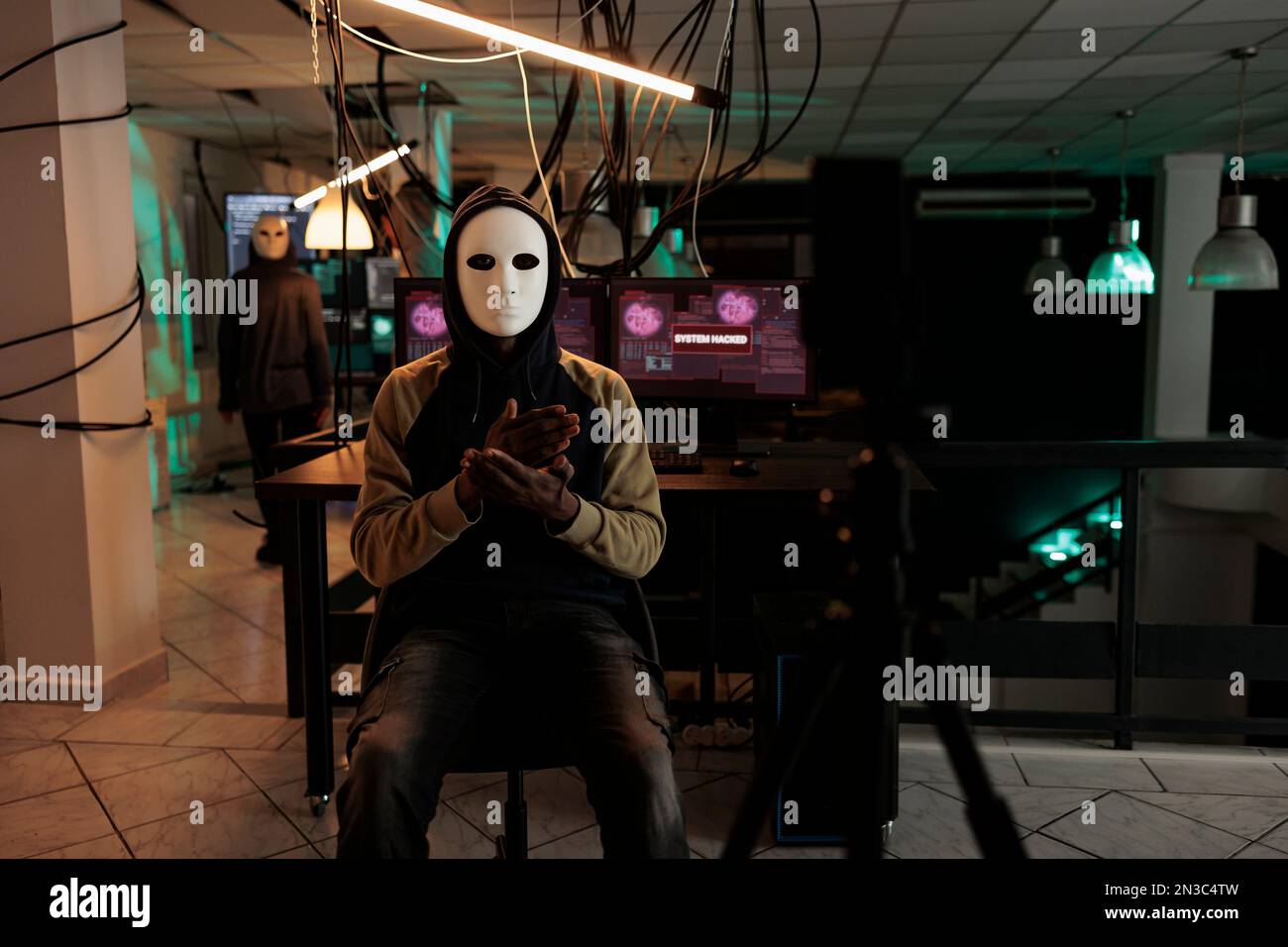 Ransomware and internet blackmail concept at night, anonymous scammer ...