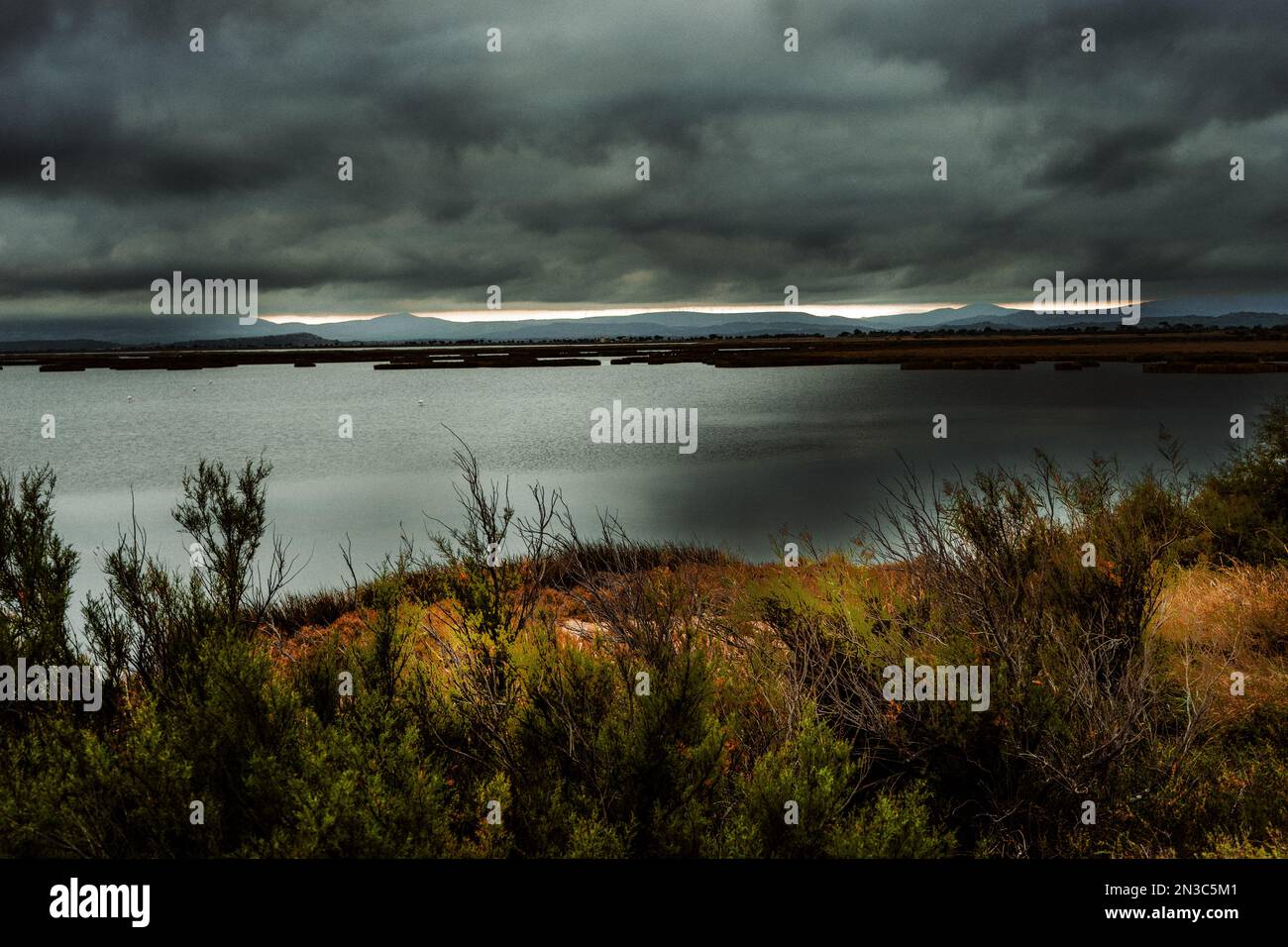 Rain clouds over the Etang de l'Ayrolle near Gruissan on the French ...