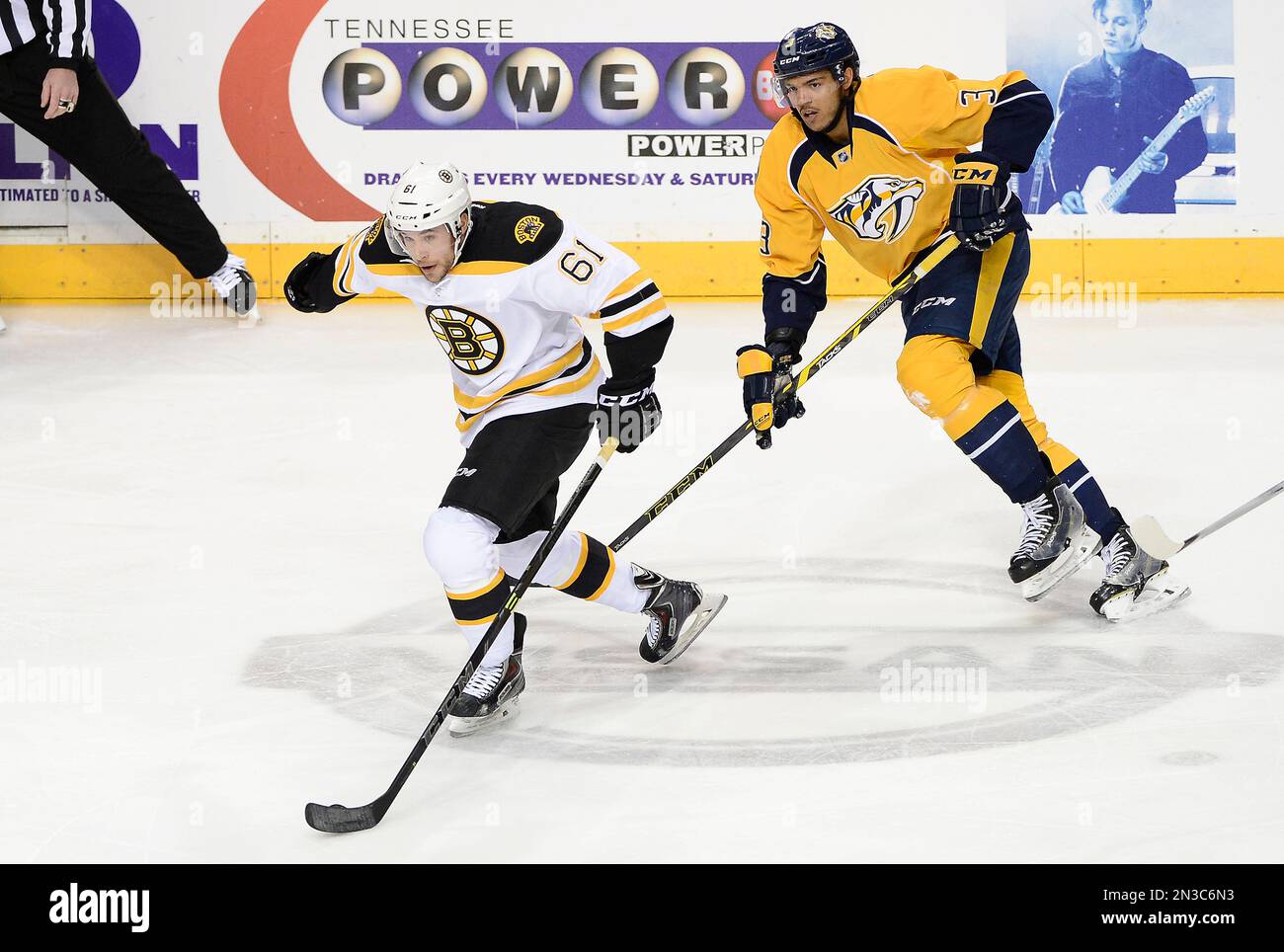 Boston Bruins left wing Craig Cunningham (61) maneuvers past Nashville ...