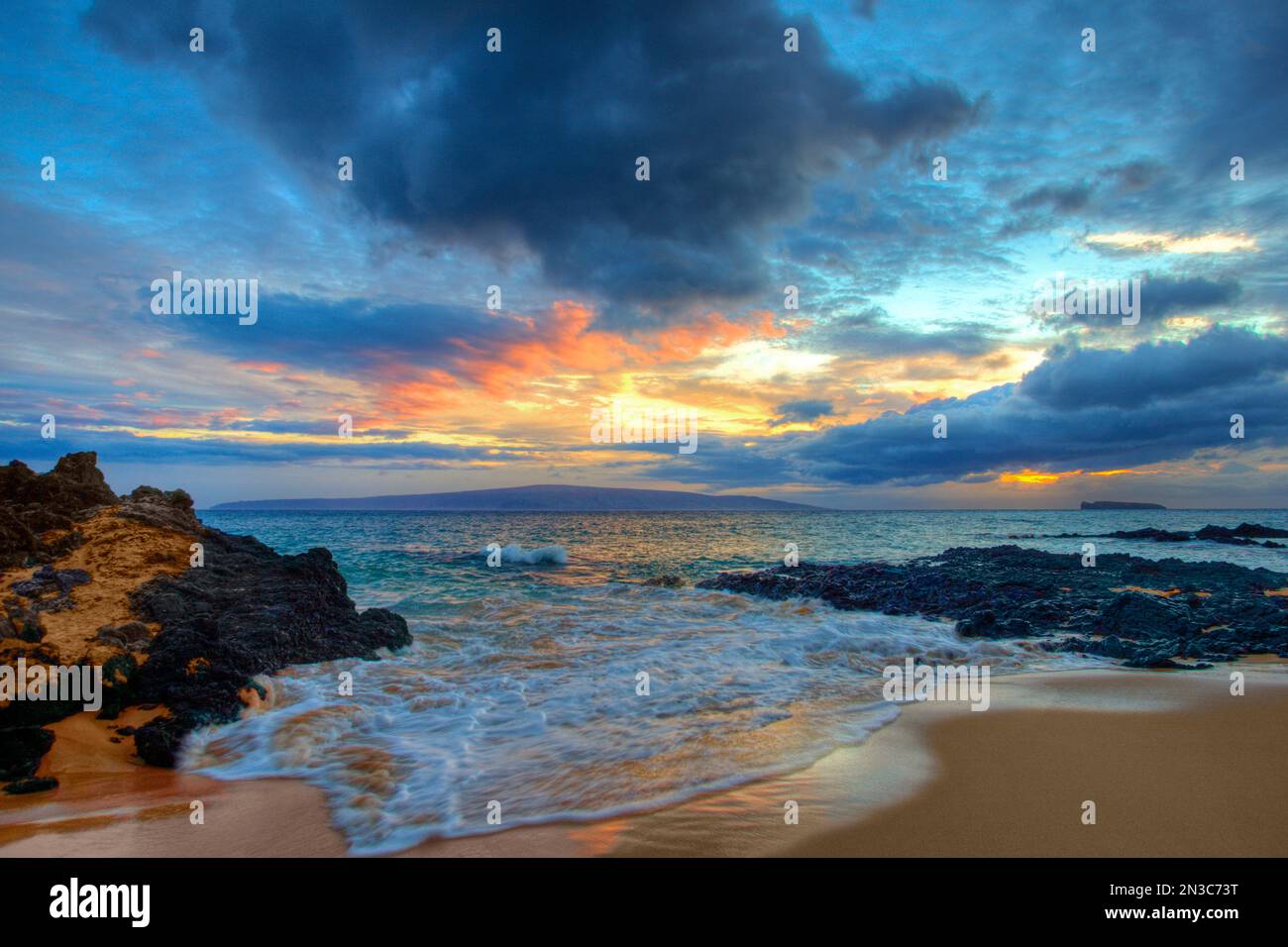 Beautiful sunset at twilight at Maui Wai or Secret Beach; Makena, Maui ...