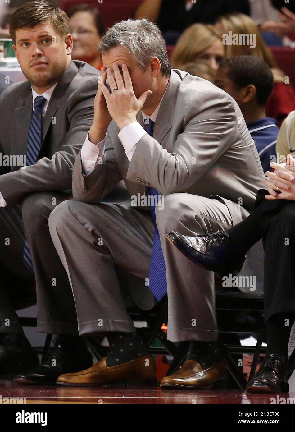 Oral Roberts head coach Scott Sutton puts his head down during the ...