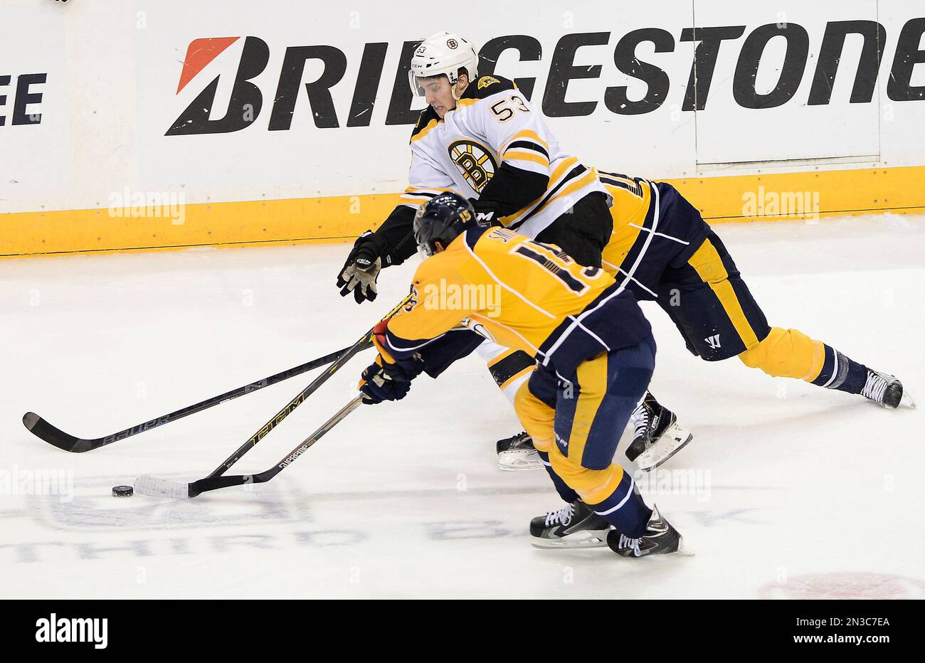 Boston Bruins Seth Griffith (53) takes the puck past Nashville ...