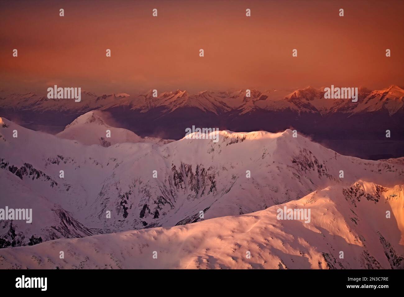 Harsh winds blow snow across the craggy ridges and peaks of the South ...