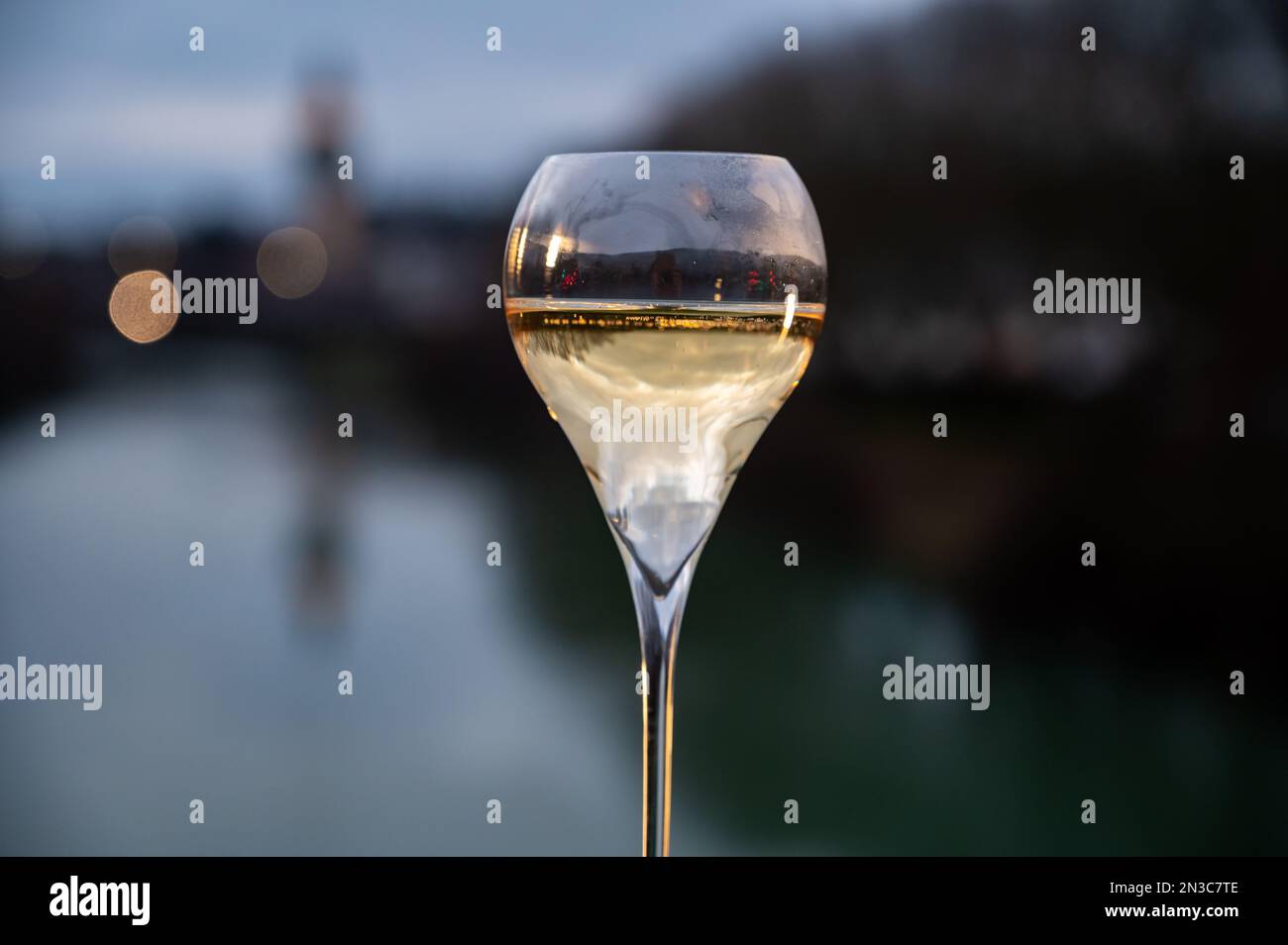 Glass of french sparkling white wine with bubbles champagne outdoor ...
