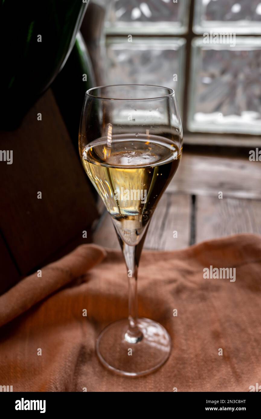 Glass of sparkling white wine champagne gran cru or cava with bubbles ...