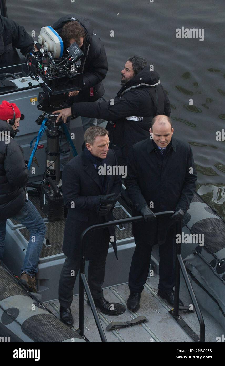 Actor Daniel Craig, front left, films a scene with Rory Kinnear ...