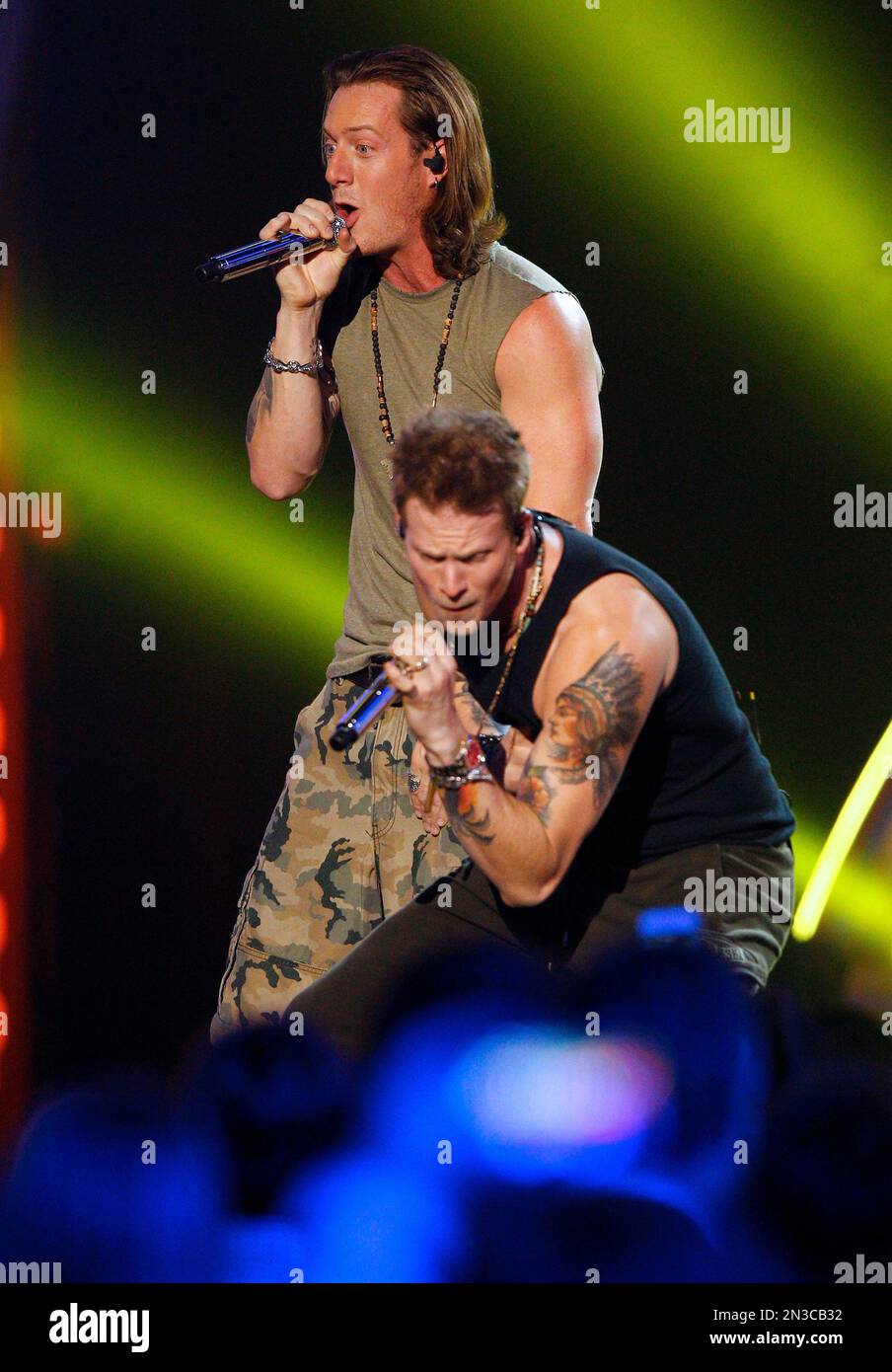Tyler Hubbard, behind, and Brian Kelley of the duo Florida Georgia Line ...