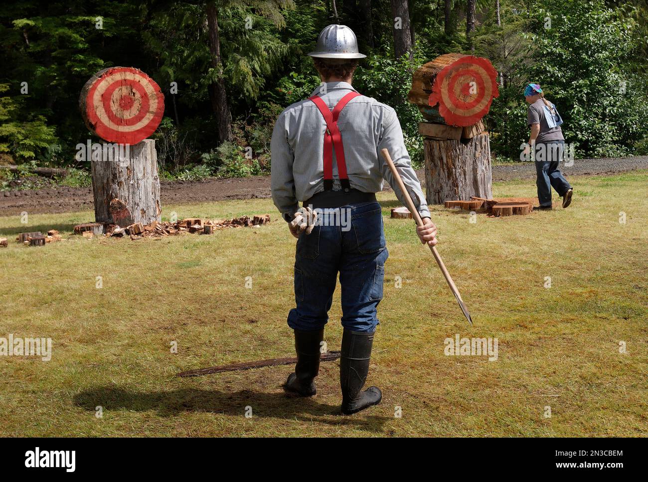 View taken from behind of lumbermen at the axe throwing contest at the ...
