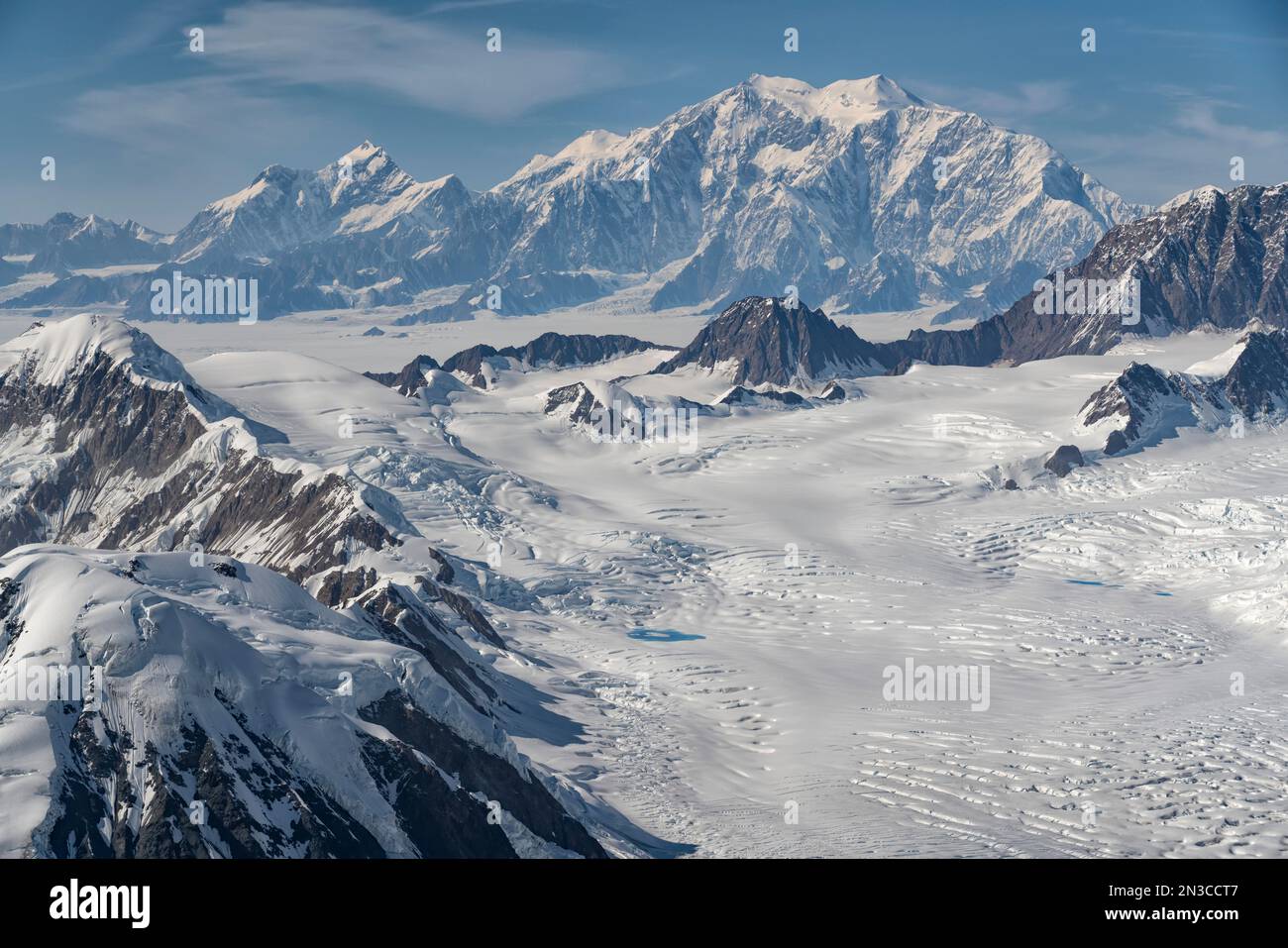 Aerial photo of Kluane National Park, with snow covered mountains making up the landscape and ...