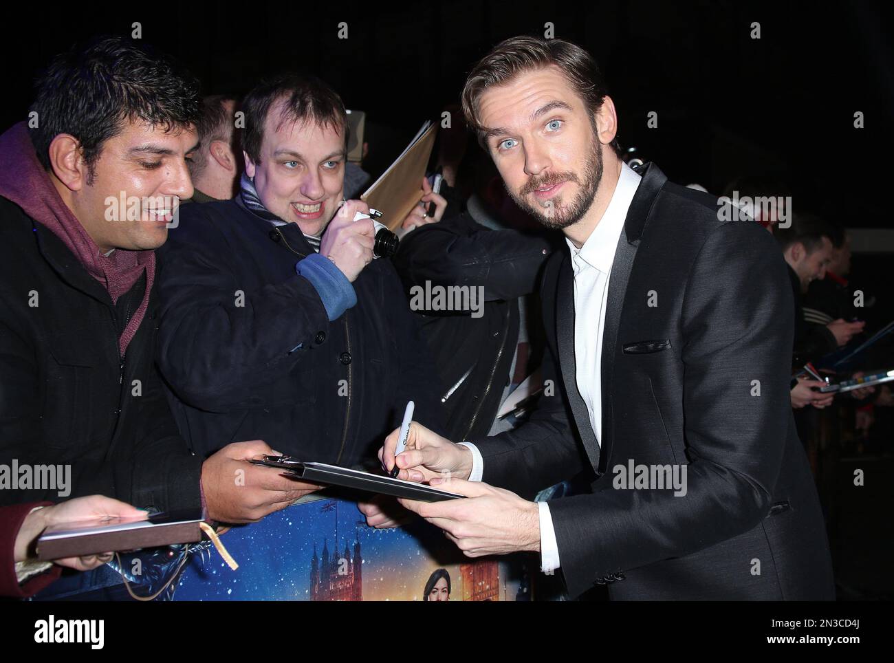 Actor Dan Stevens signs autographs for fans upon arrival for the ...