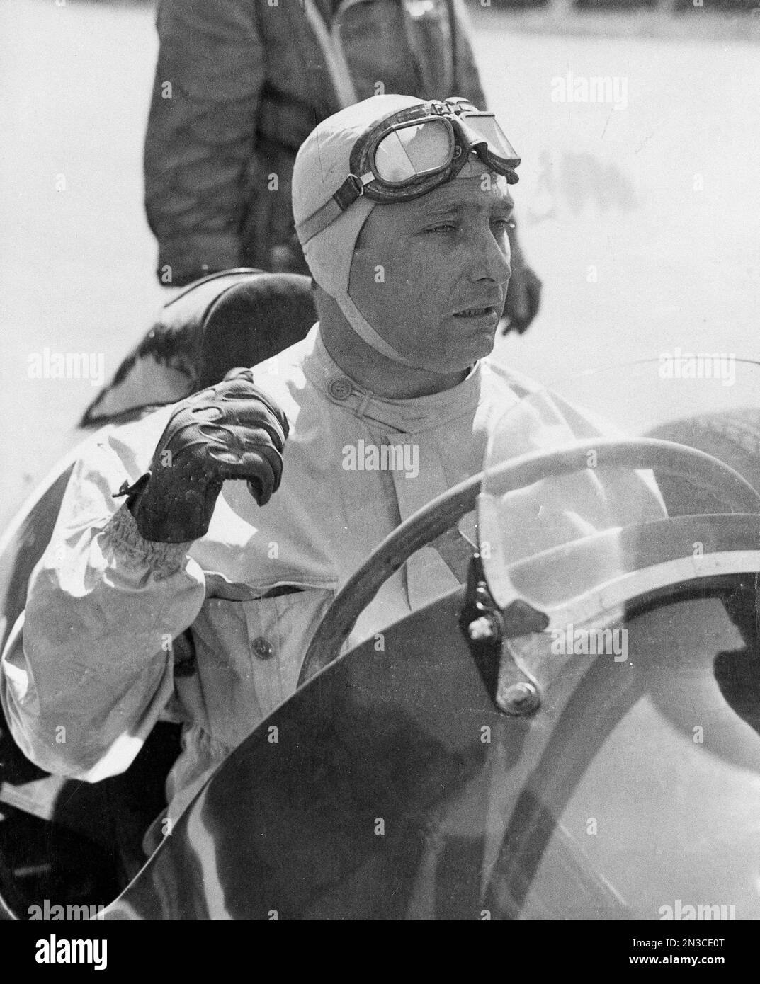 Juan Manuel Fangio is pictured in the cockpit of his Alfa Romeo at the ...