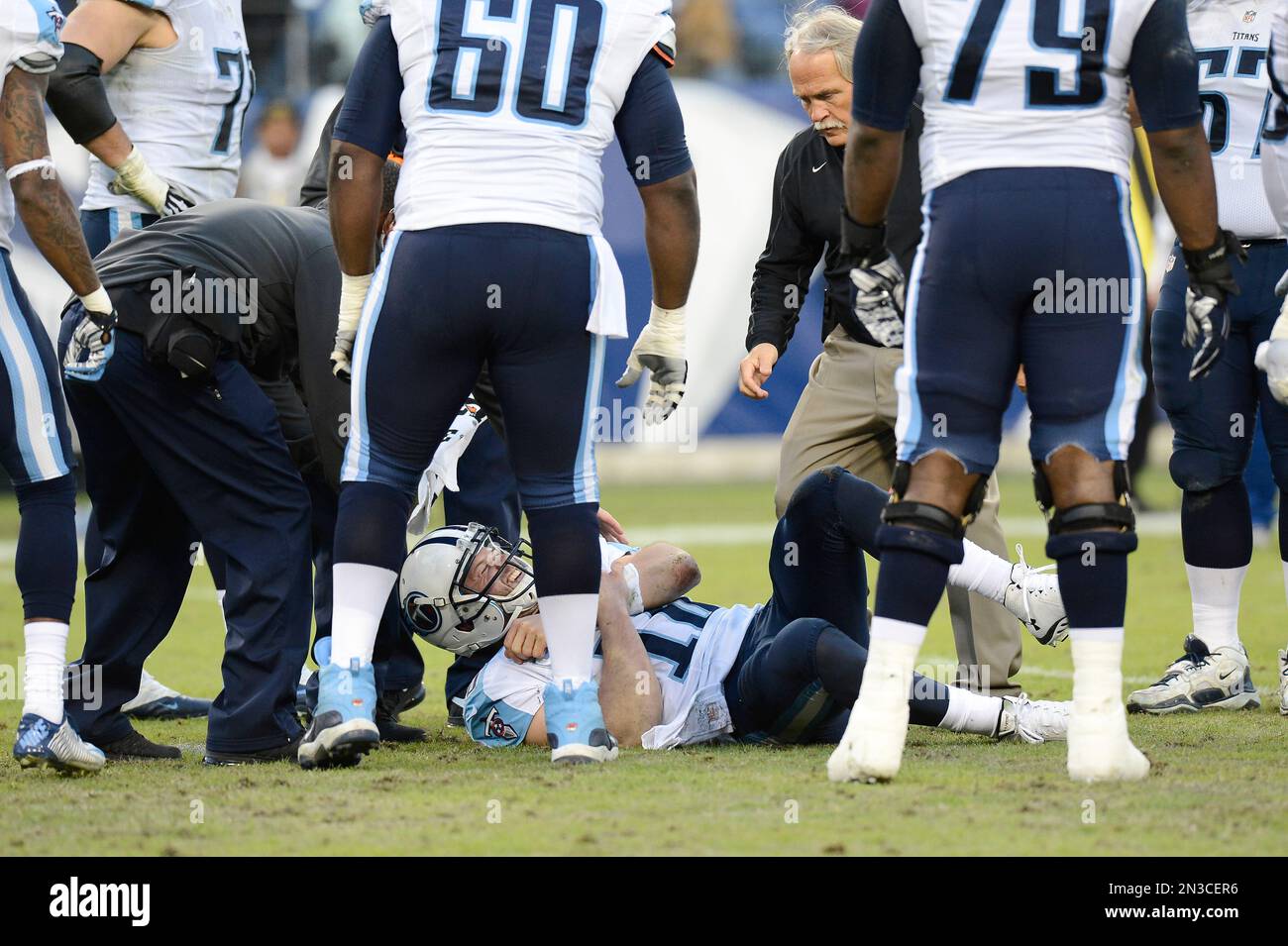 Tennessee Titans quarterback Jake Locker lies on the field after being ...