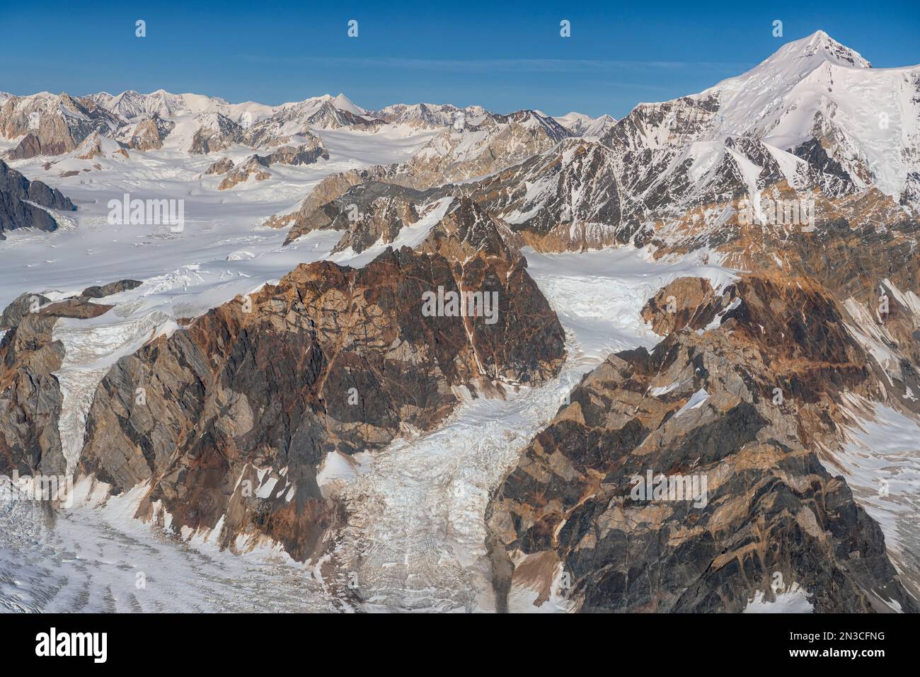 Aerial view of the jagged, rock faces of the mountain peaks and the ...