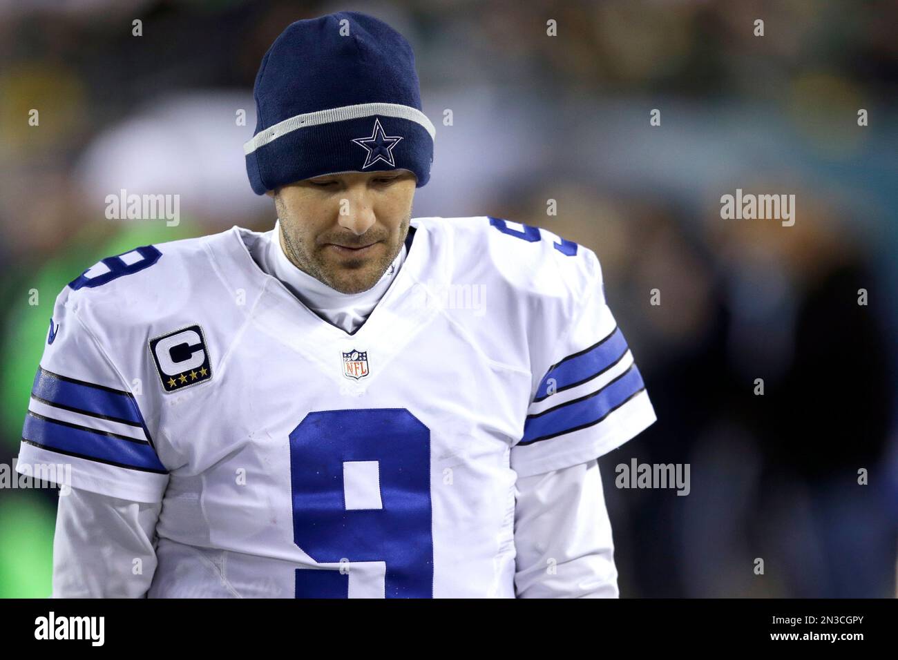 Dallas Cowboys' Tony Romo walks the sidelines during the second half of ...