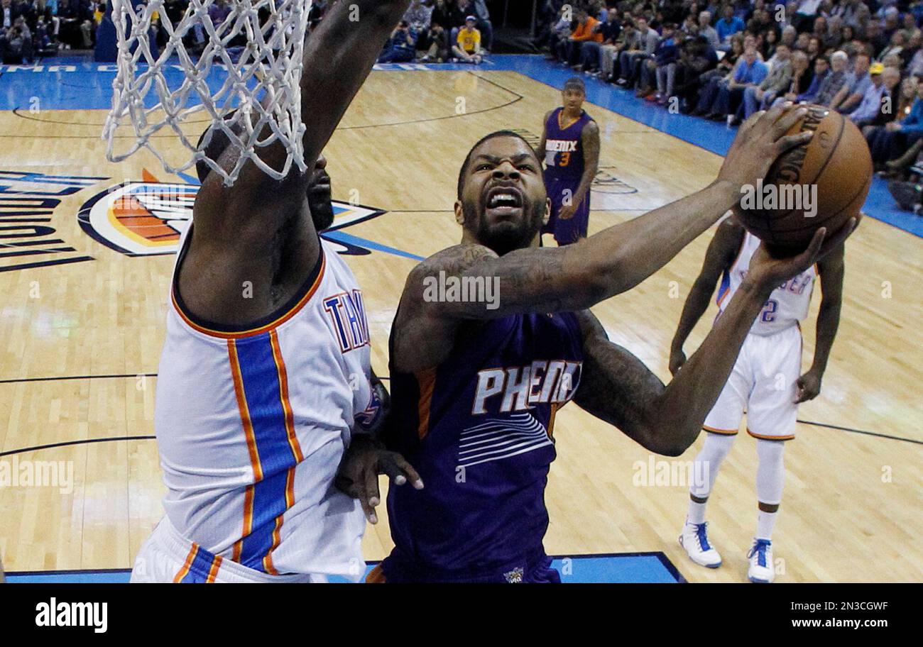 Phoenix Suns forward Marcus Morris, right, shoots as Oklahoma City ...