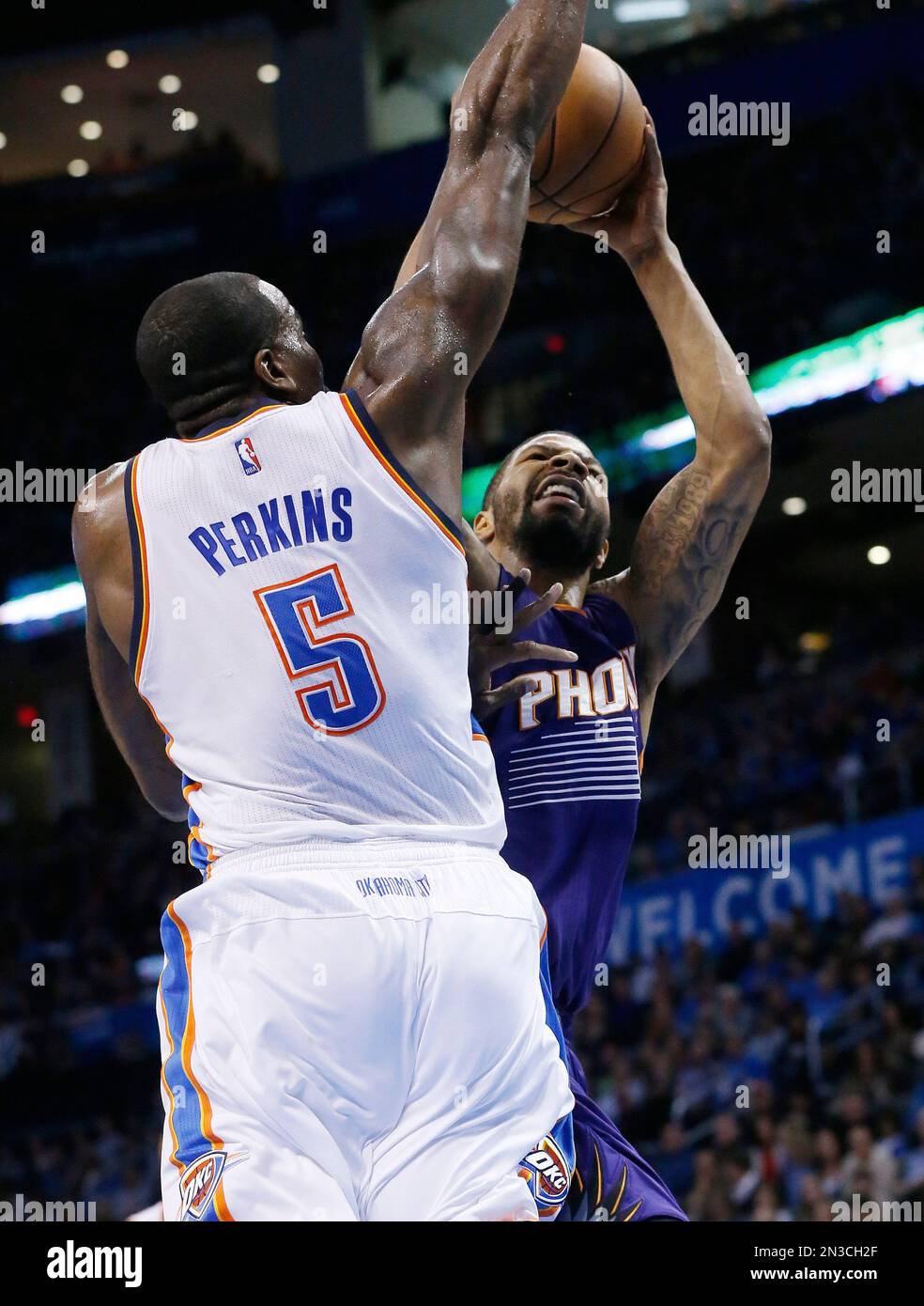 Phoenix Suns forward Marcus Morris, right, shoots as Oklahoma City ...