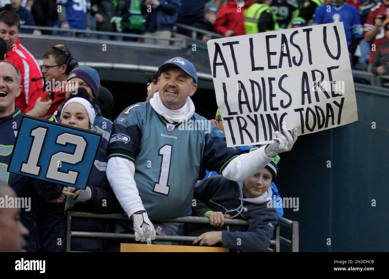 A Seattle Seahawks fan holds up a sign mocking the San Francisco 49ers ...