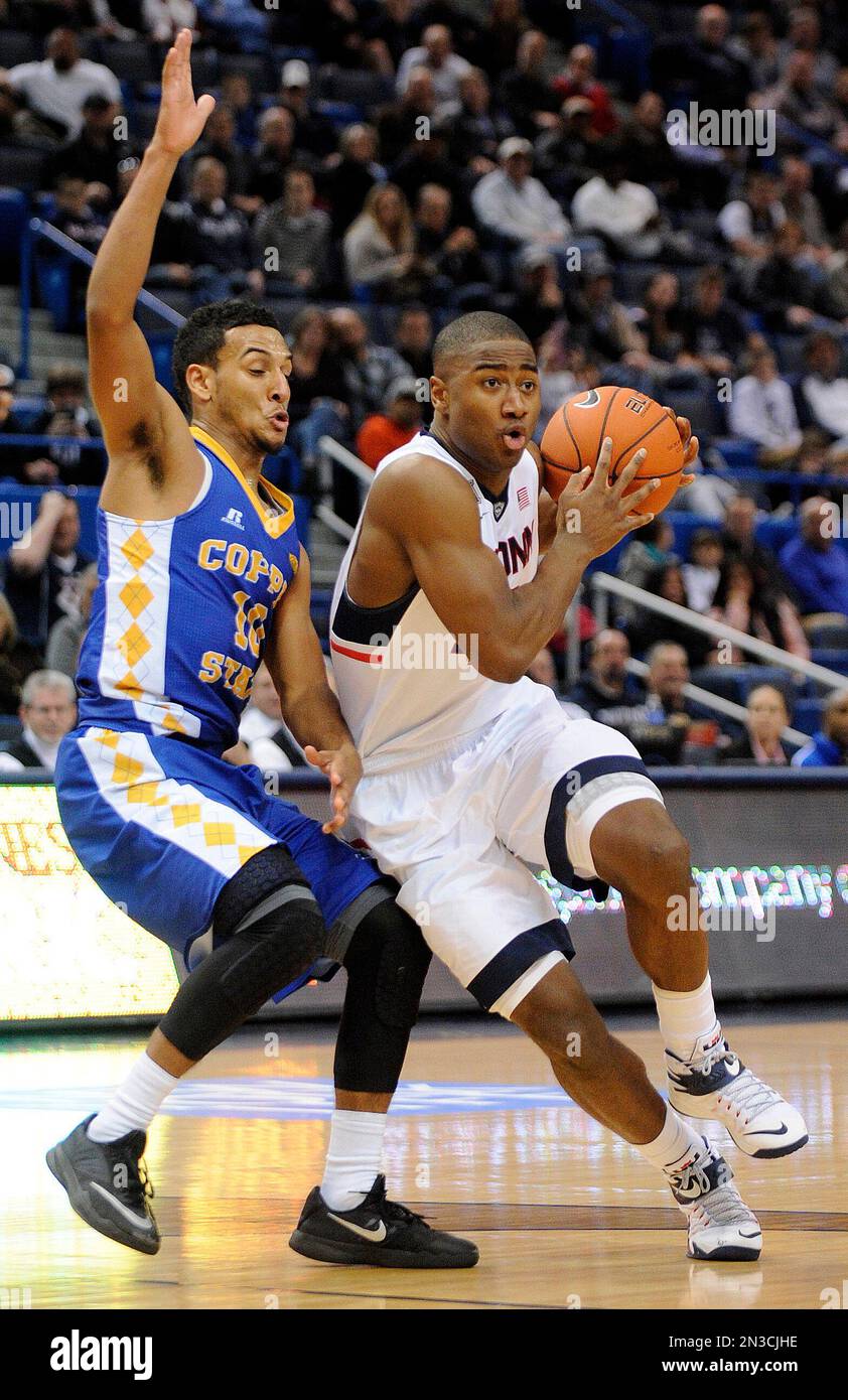 Connecticut's Rodney Purvis (44) drives past Coppin State's Christian ...