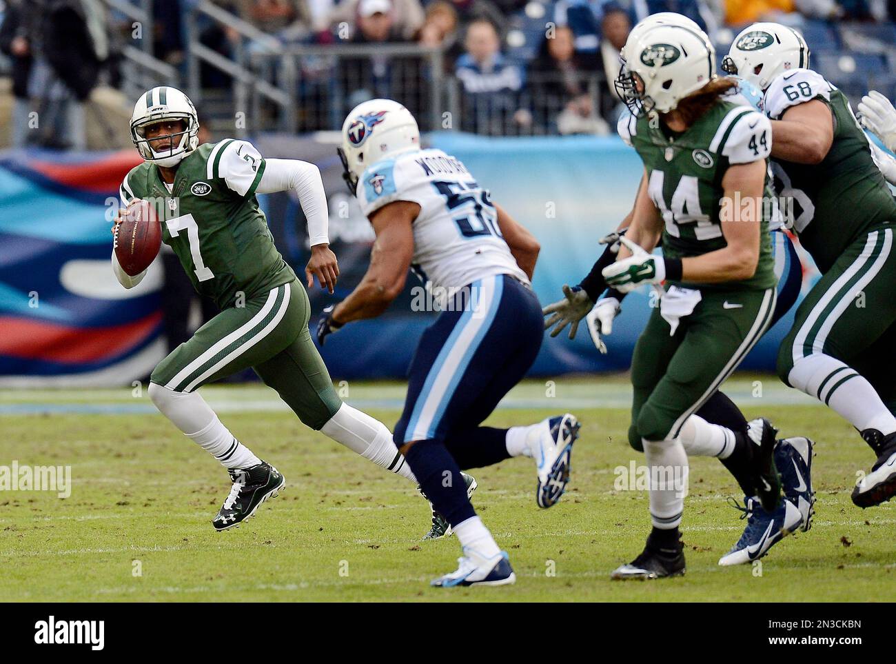 New York Jets quarterback Geno Smith (7) scrambles as he is pressured ...