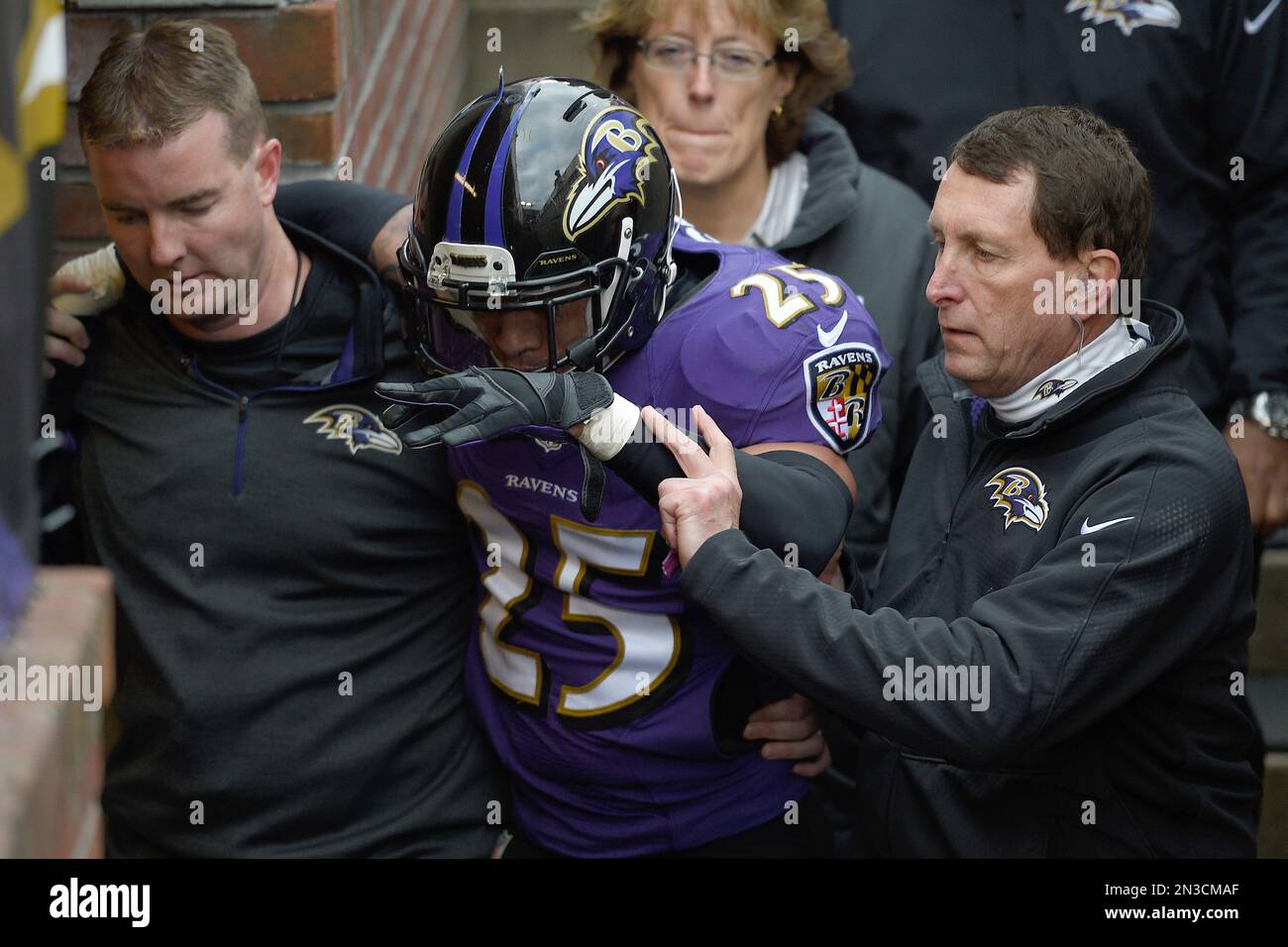 Baltimore Ravens cornerback Asa Jackson (25) is helped off the field ...