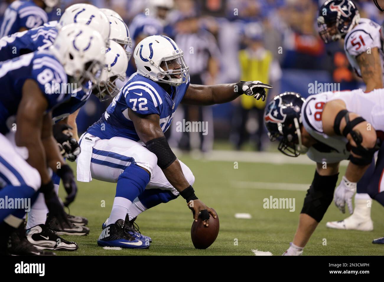 Indianapolis Colts center Jonotthan Harrison points out at the line of ...