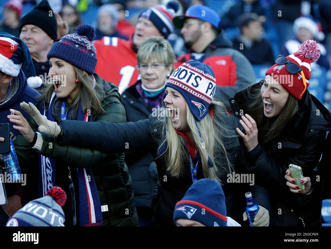 New England Patriots fans cheer before an NFL football game between the ...
