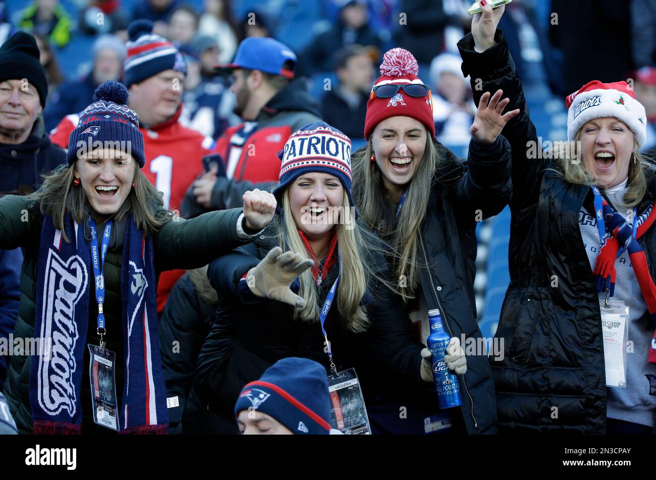 New England Patriots fans cheer before an NFL football game between the ...