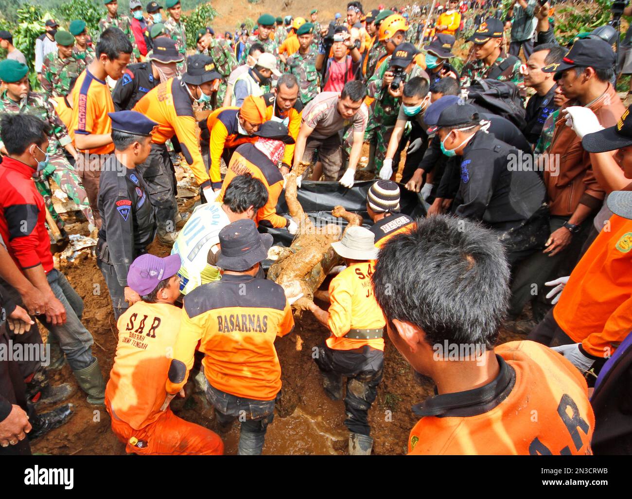 EDS NOTE: GRAPHIC CONTENT - Rescuers pull the body of a victim from the ...