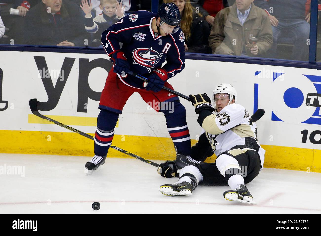 Columbus Blue Jackets' Jack Johnson (7) collides with Pittsburgh ...
