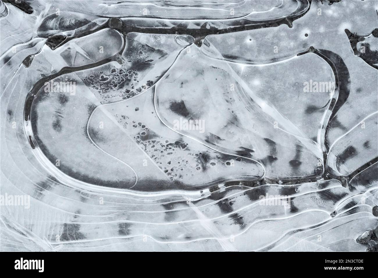 Smooth,curved ice patterns on streets; Sitka, Alaska, United States of ...