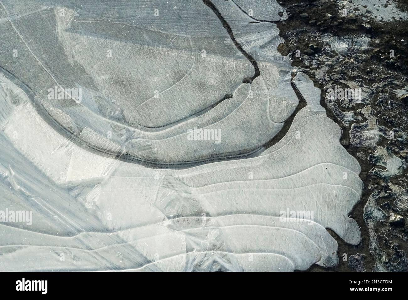Smooth,curved ice patterns on streets; Sitka, Alaska, United States of ...