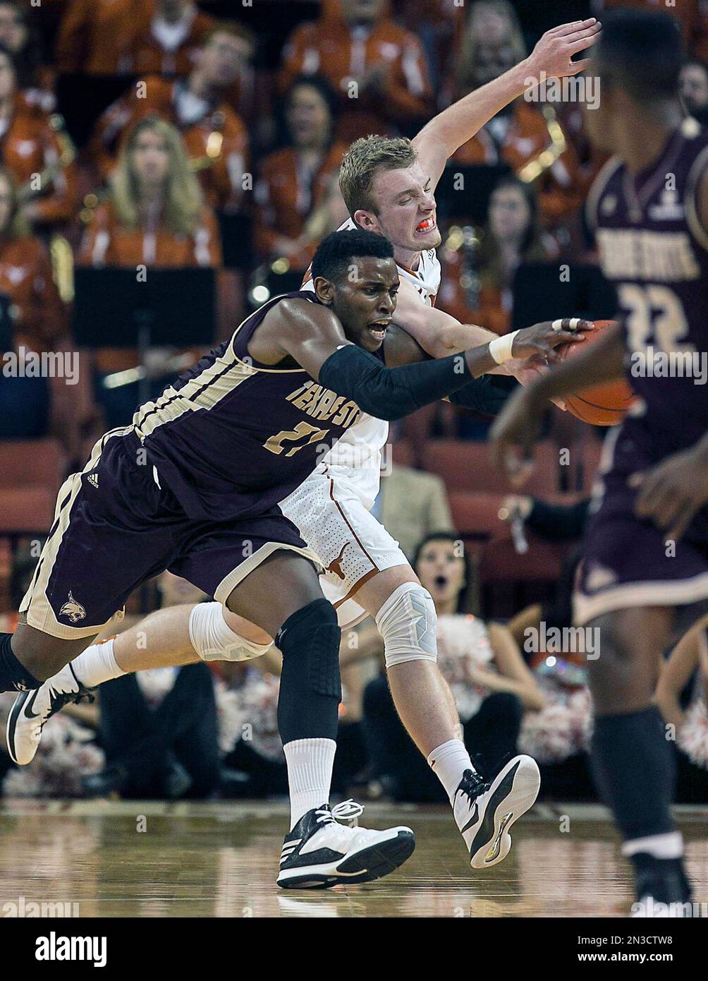 Texas State Emani Gant (21) and Texas Connor Lammert, right, chase down ...