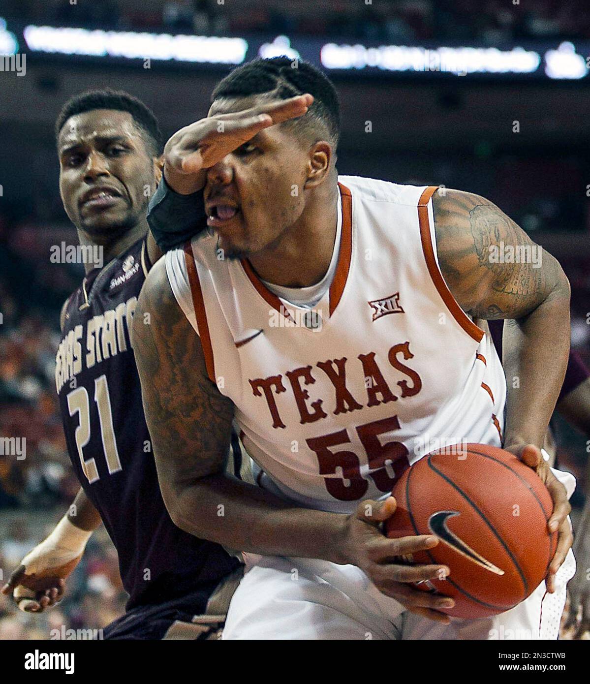 Texas Cameron Ridley (55) is struck in the nose by Texas State Emani ...