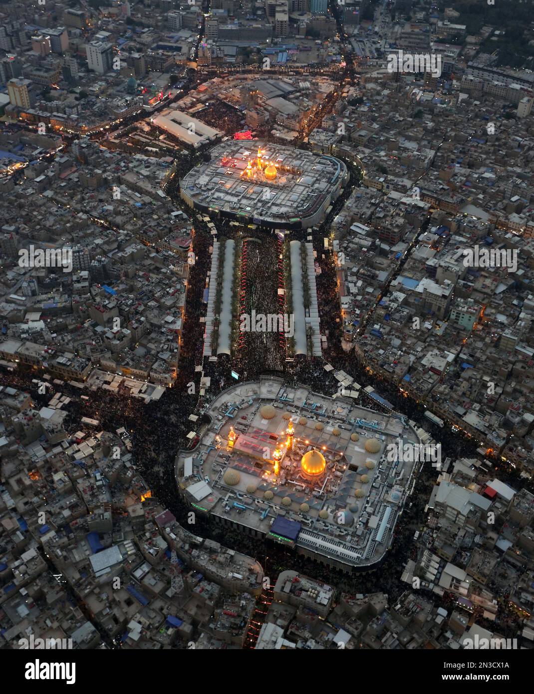 This aerial photo shows Shiite faithful pilgrims gather between, the ...