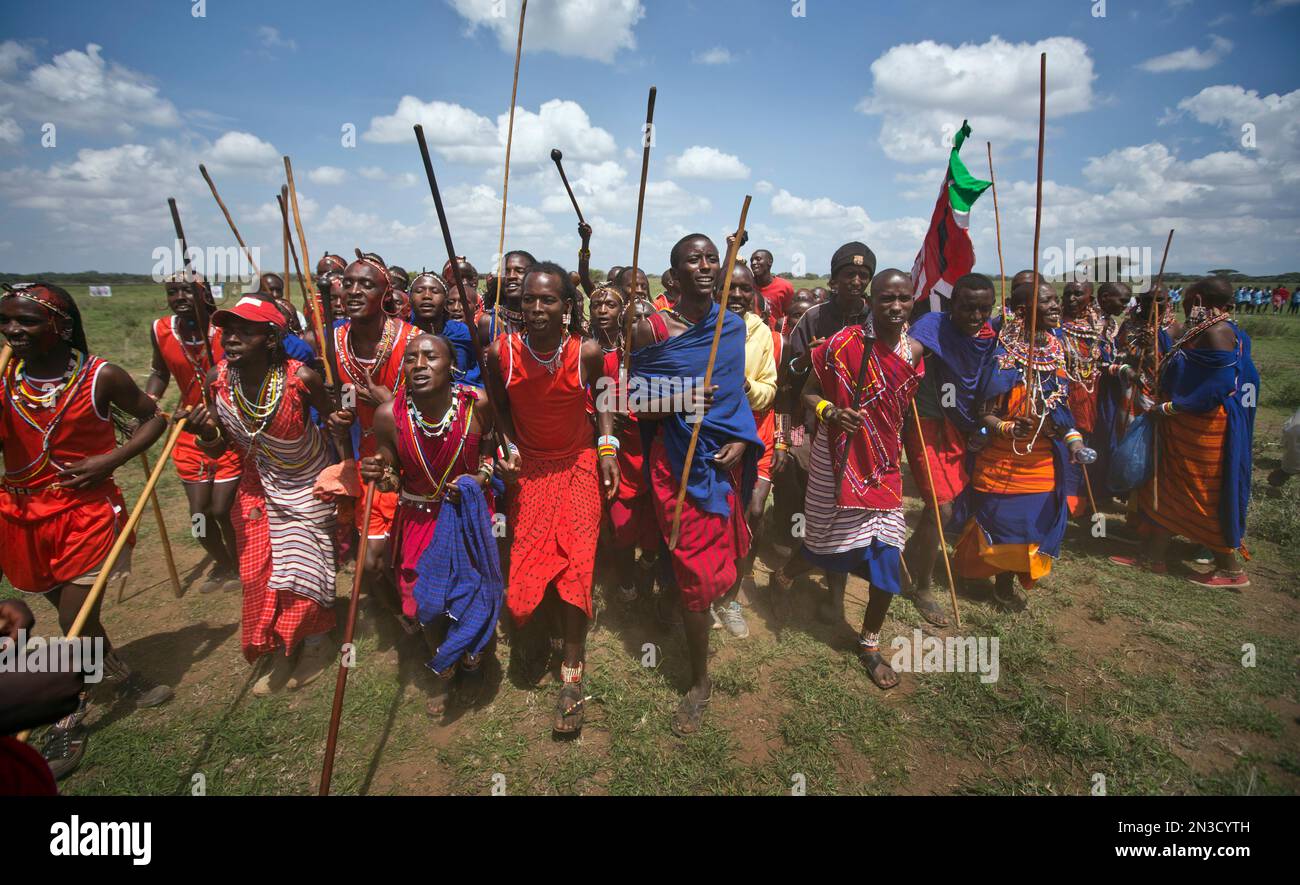 Maasai run and whoop after a young warrior from their village won a ...