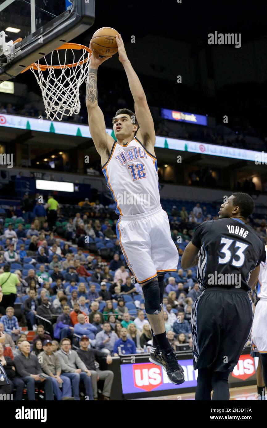 Oklahoma City Thunder center Steven Adams (12), of New Zealand dunks over Minnesota Timberwolves ...